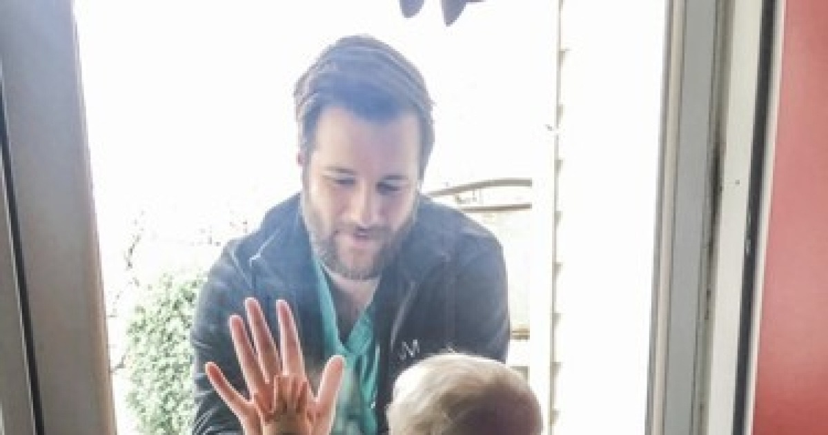 Virus Outbreak Father Son Photo
