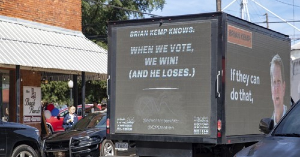 Protesters Attend Brian Kemp Campaign Bus Tour