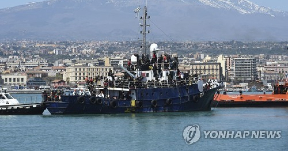 APTOPIX Migration Italy