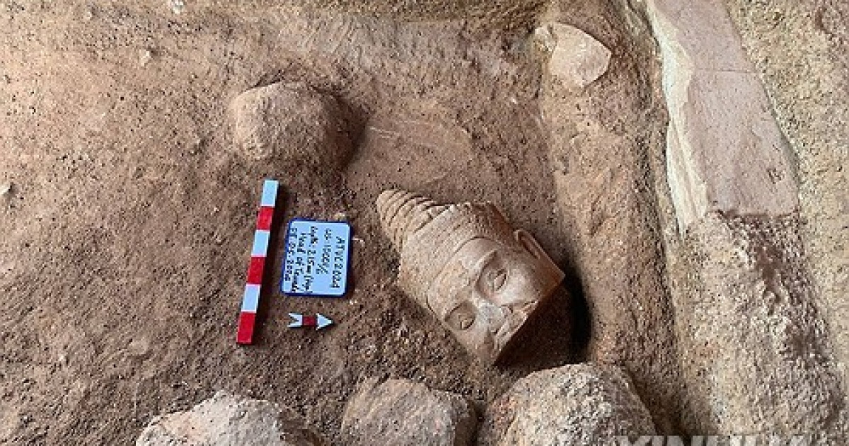 CAMBODIA-SIEM REAP-DEVA STATUE HEAD